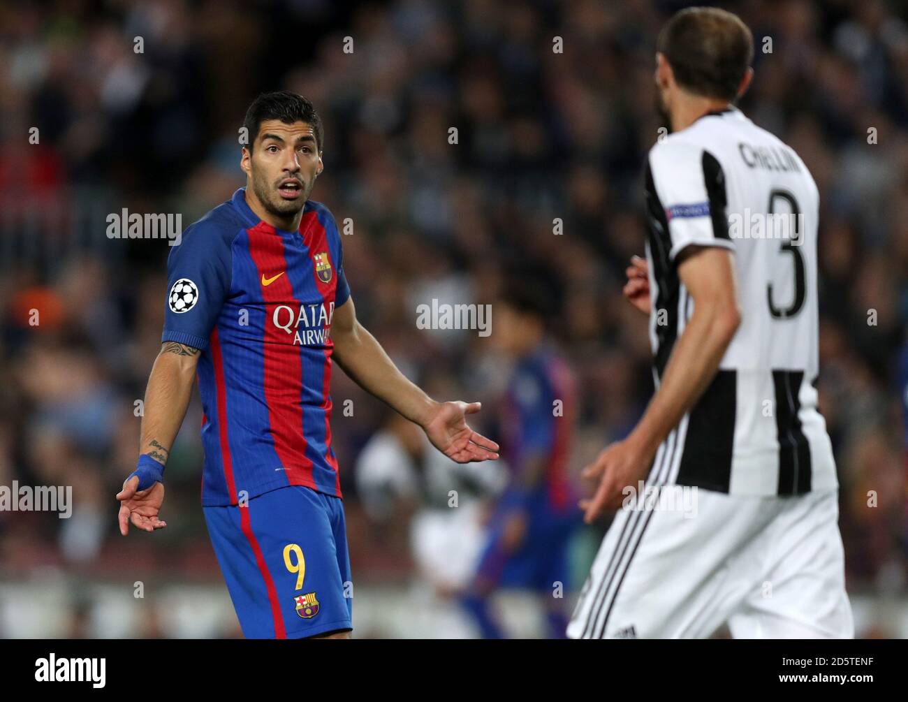 Barcelona's Luis Suarez (left) exchanges words with Juventus' Giorgio ...