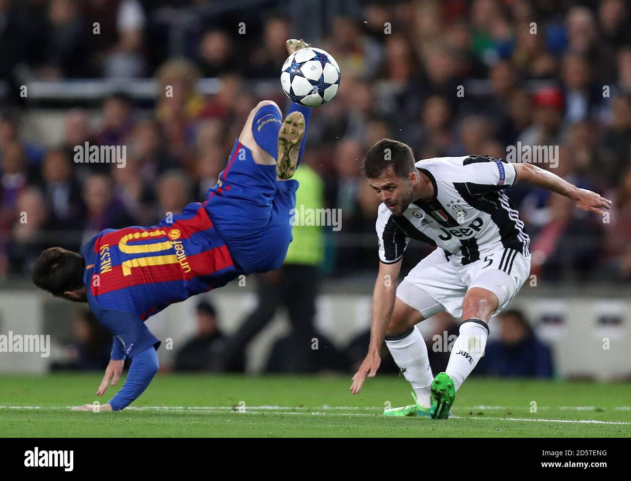 Barcelona's Lionel Messi (left) is fouled by Juventus' Miralem Pjanic ...