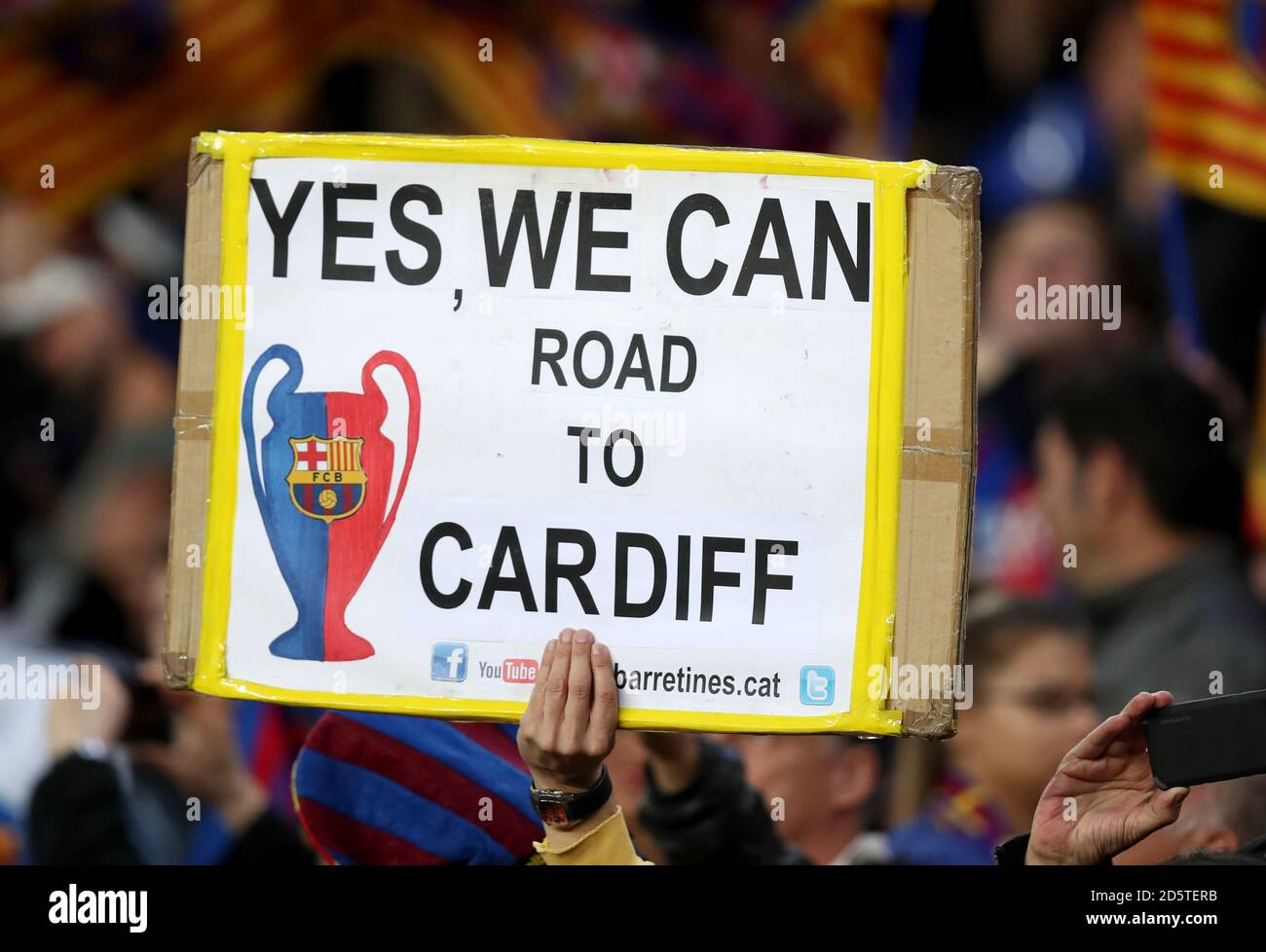 Barcelona fans in the stands hold up a Yes We Can Road To Cardiff sign ...