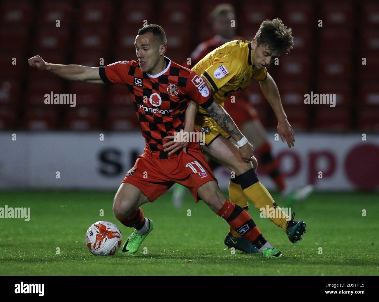 Walsall's Kieron Morris and Port Vale's Billy Reeves battle for the ...