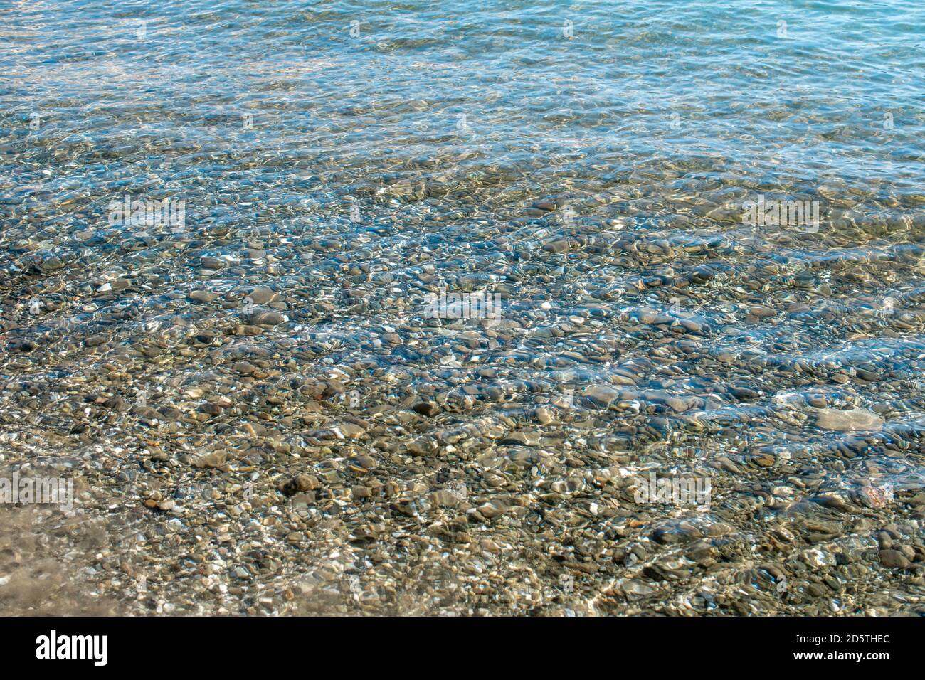 Background Of Sea Pebbles Under Water On Beach. Pebbles under clear ...