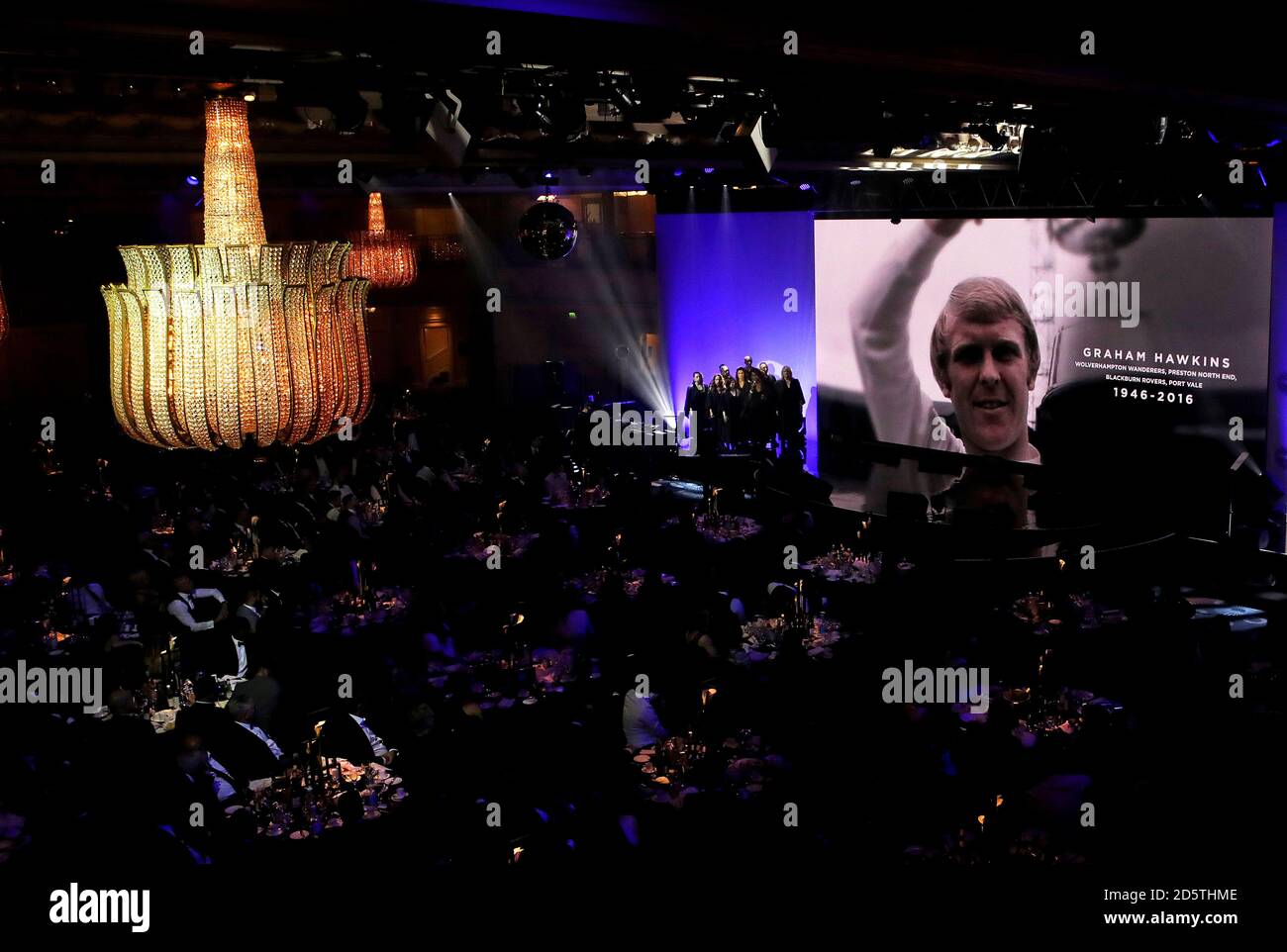 A tribute to Graham Hawkins on the big screen during the Professional ...