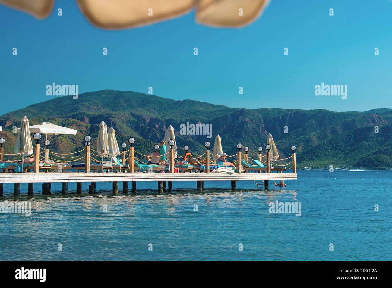 Marmaris, Turkey - October 13, 2020: People are stand and lie on the on ...