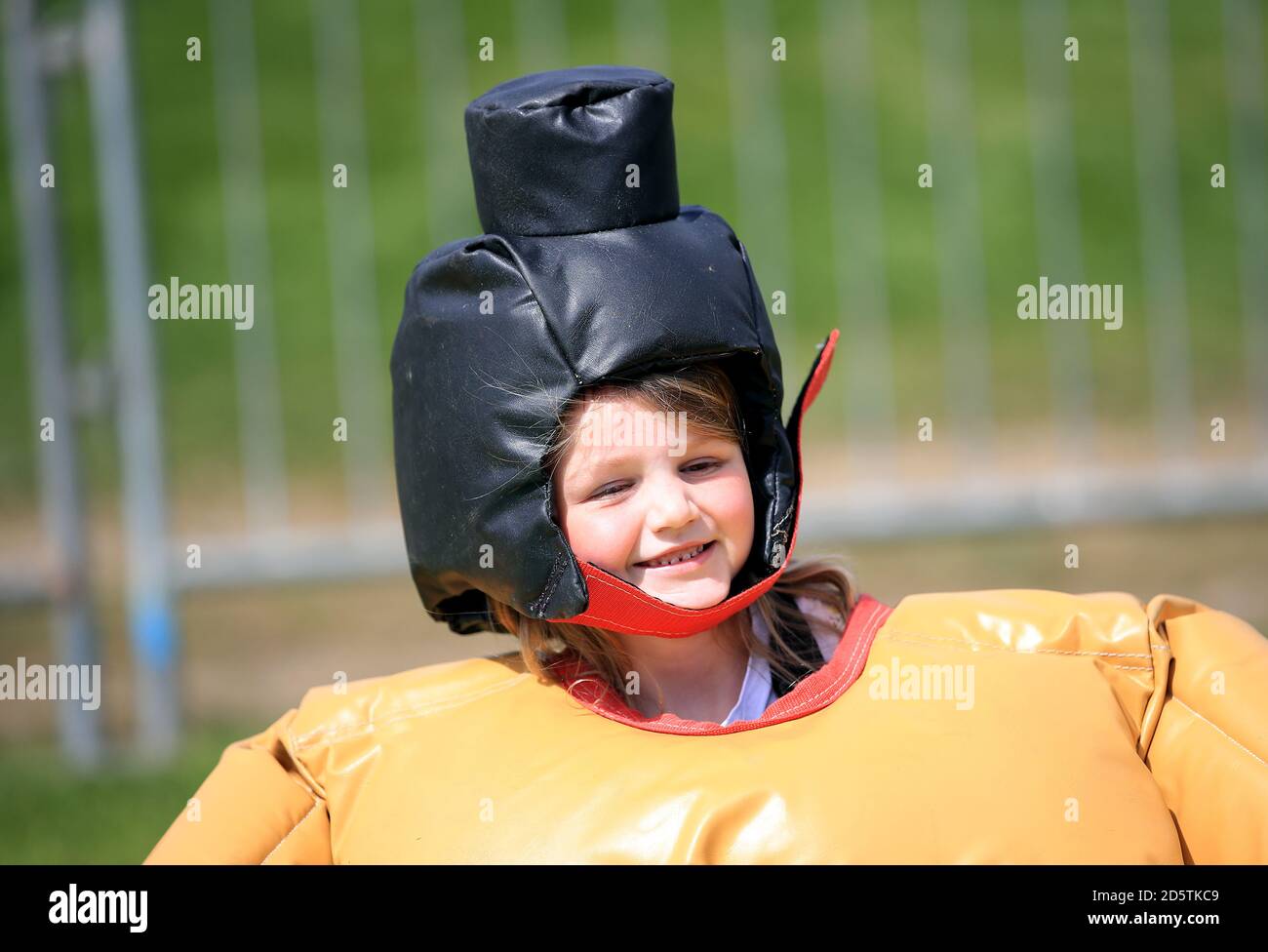 A young racegoer enjoys the activities held on Kids Carnival Day at ...