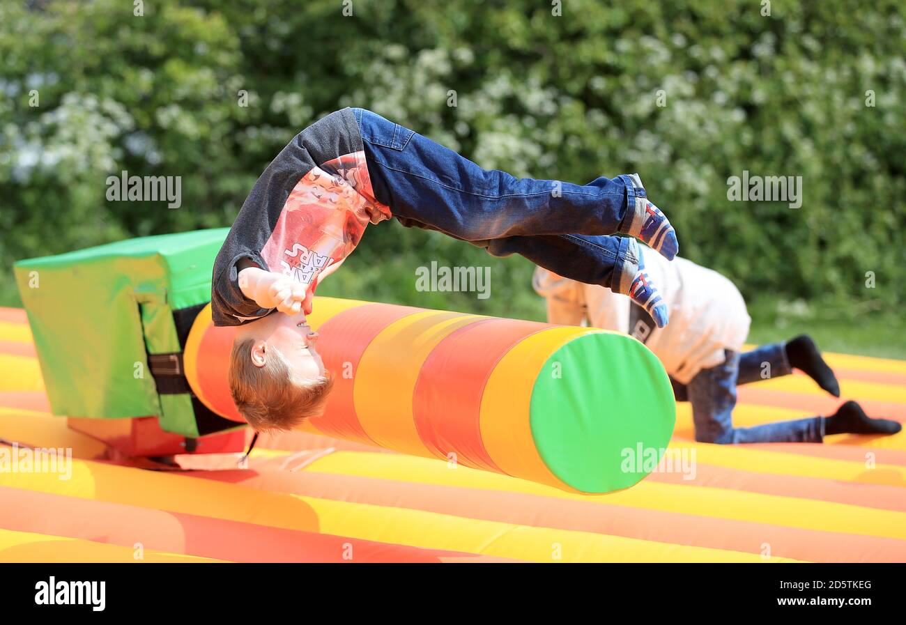 A young racegoer enjoys the activities held on Kids Carnival Day at ...