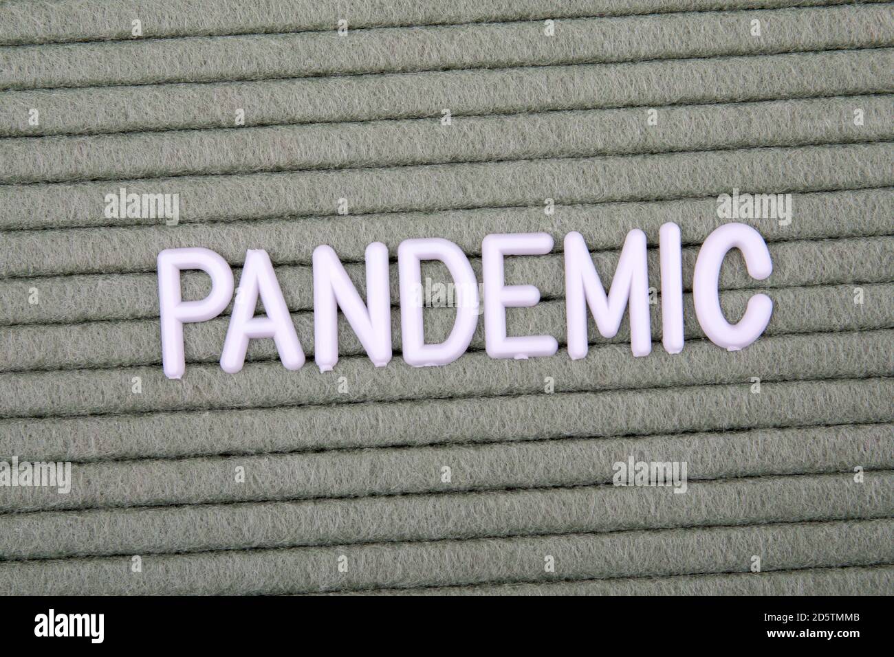 PANDEMIC. Health concept. White letters of the alphabet on a green ...