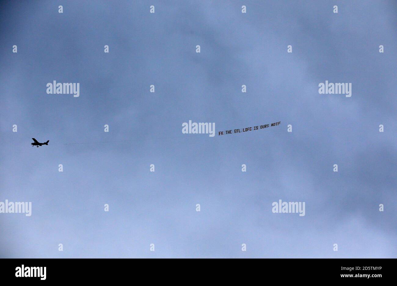 An aerial banner is flown from a plane above the stadium Stock Photo ...