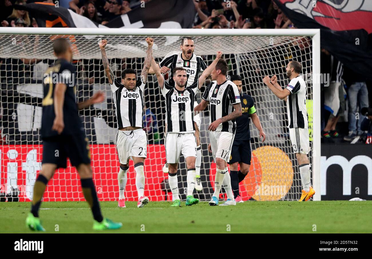 Juventus' Daniel Alves (left), Juventus' Miralem Pjanic (centre ...