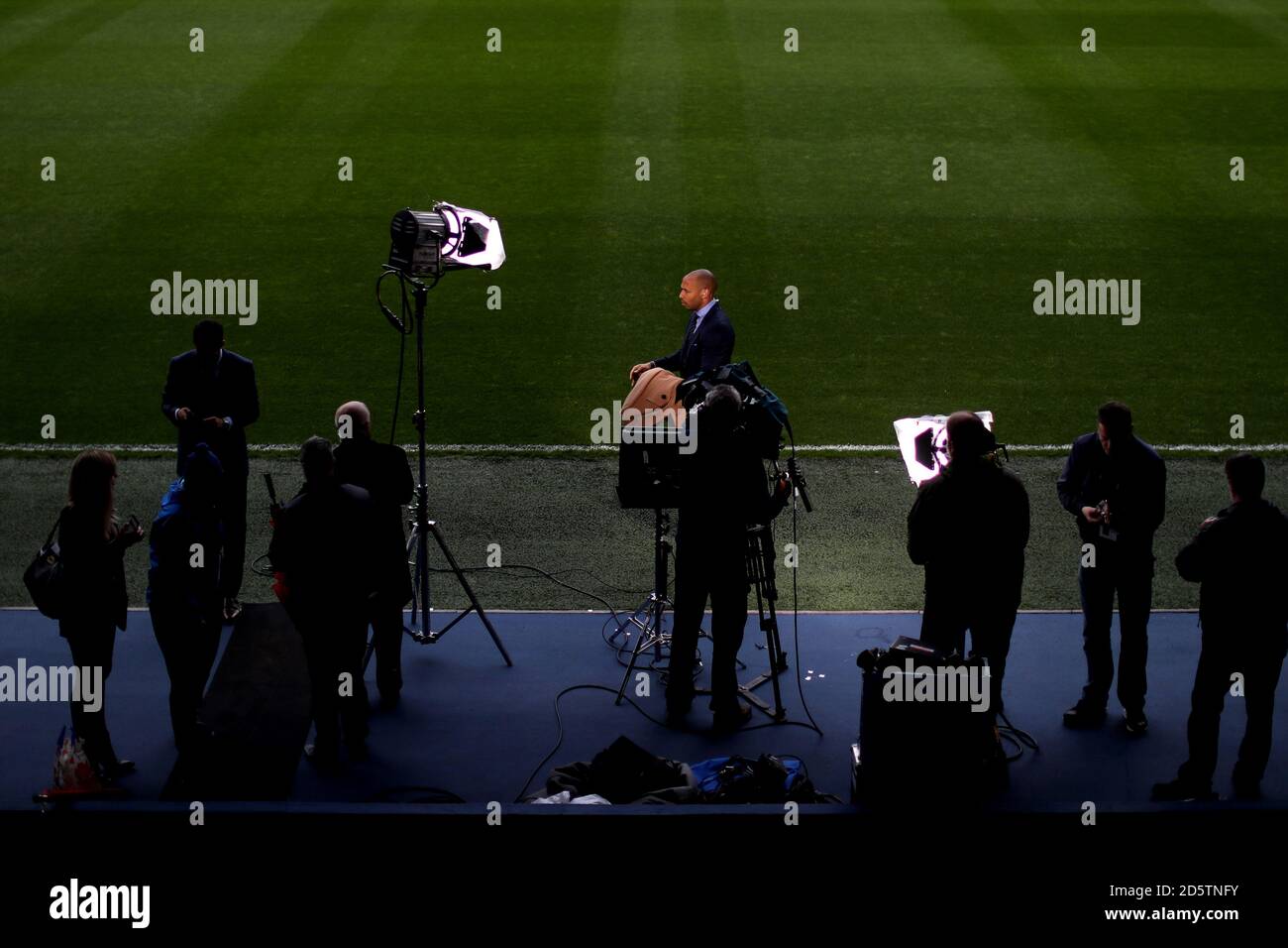 Sky TV pundit Thierry Henry prepares pitchside before the game Stock ...