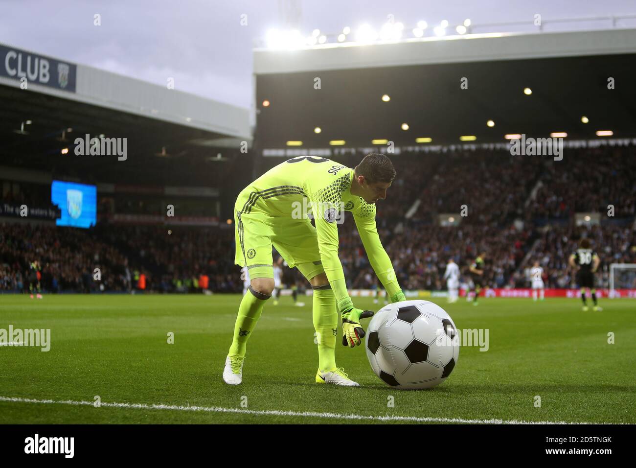A inflated football is removed from the pitch by Chelsea goalkeeper ...