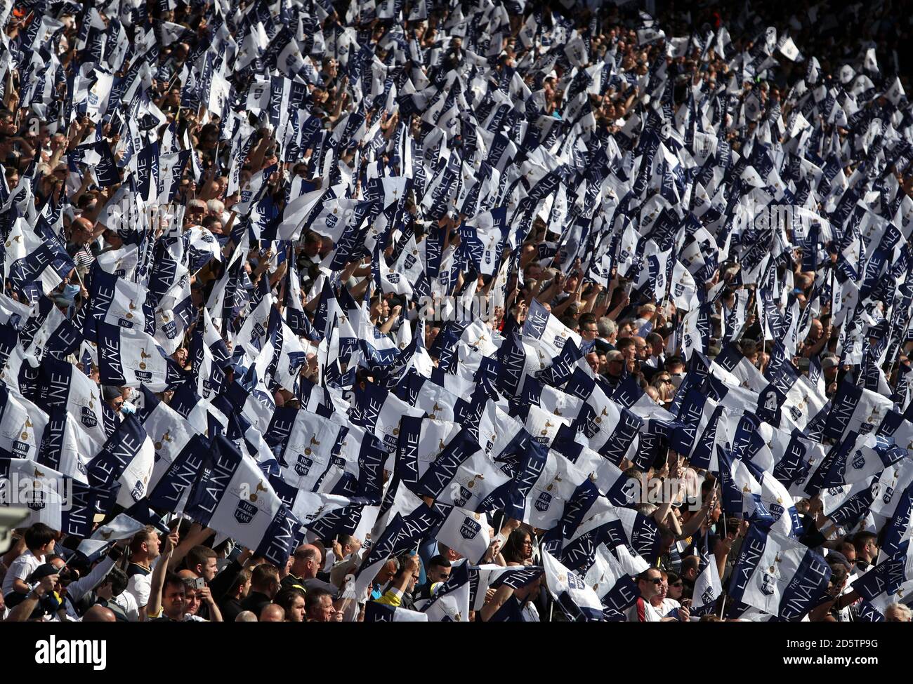 Tottenham Hotspur fans hold up flags to commemorate the final game at ...