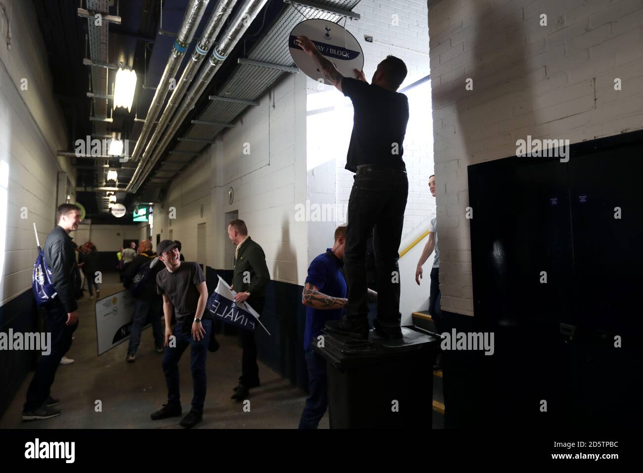 Fans scavenge parts of White Hart Lane after the final game played ...