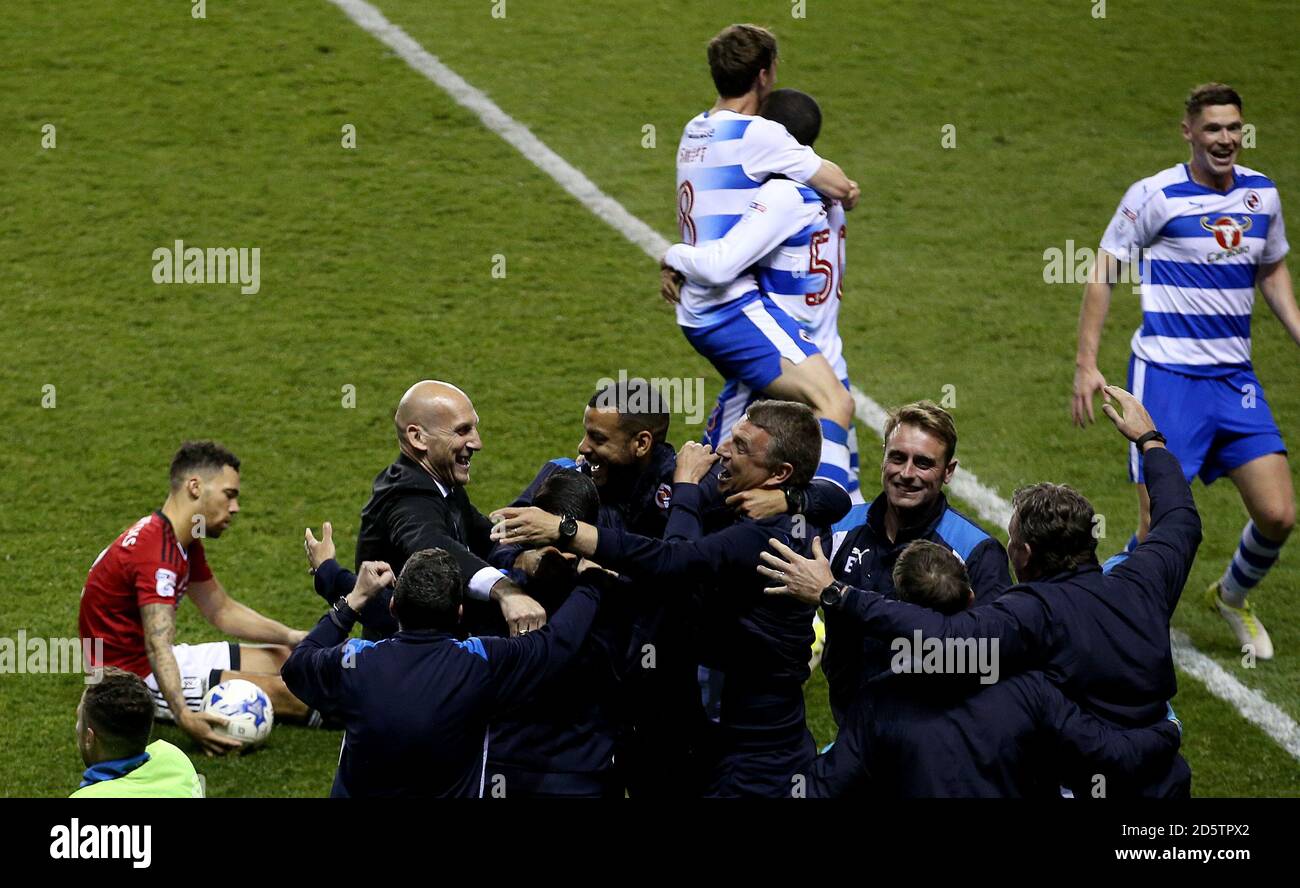 Reading manager Jaap Stam celebrates at full time with players and ...