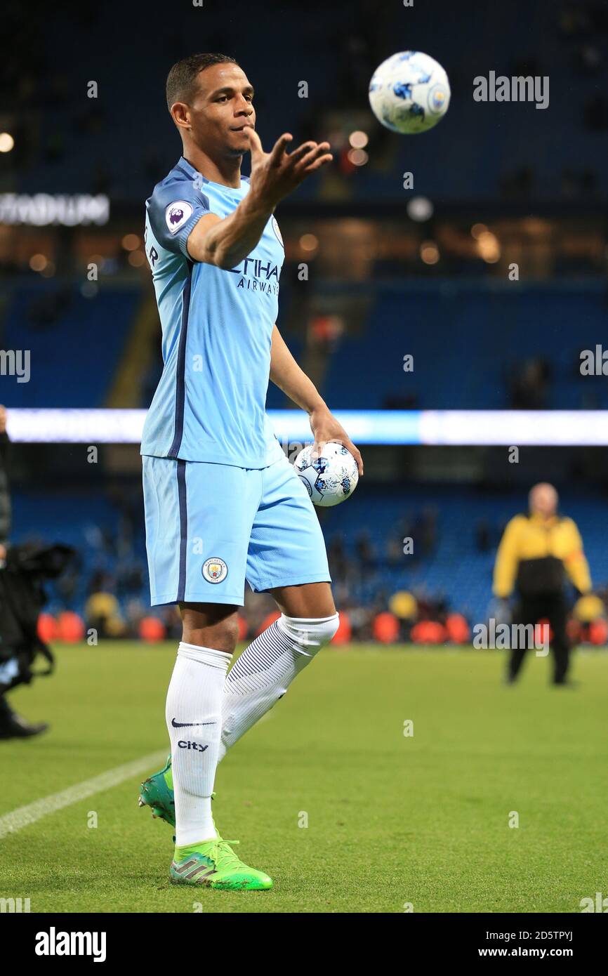 Manchester City's Fernando throws footballs into the crowd after the ...