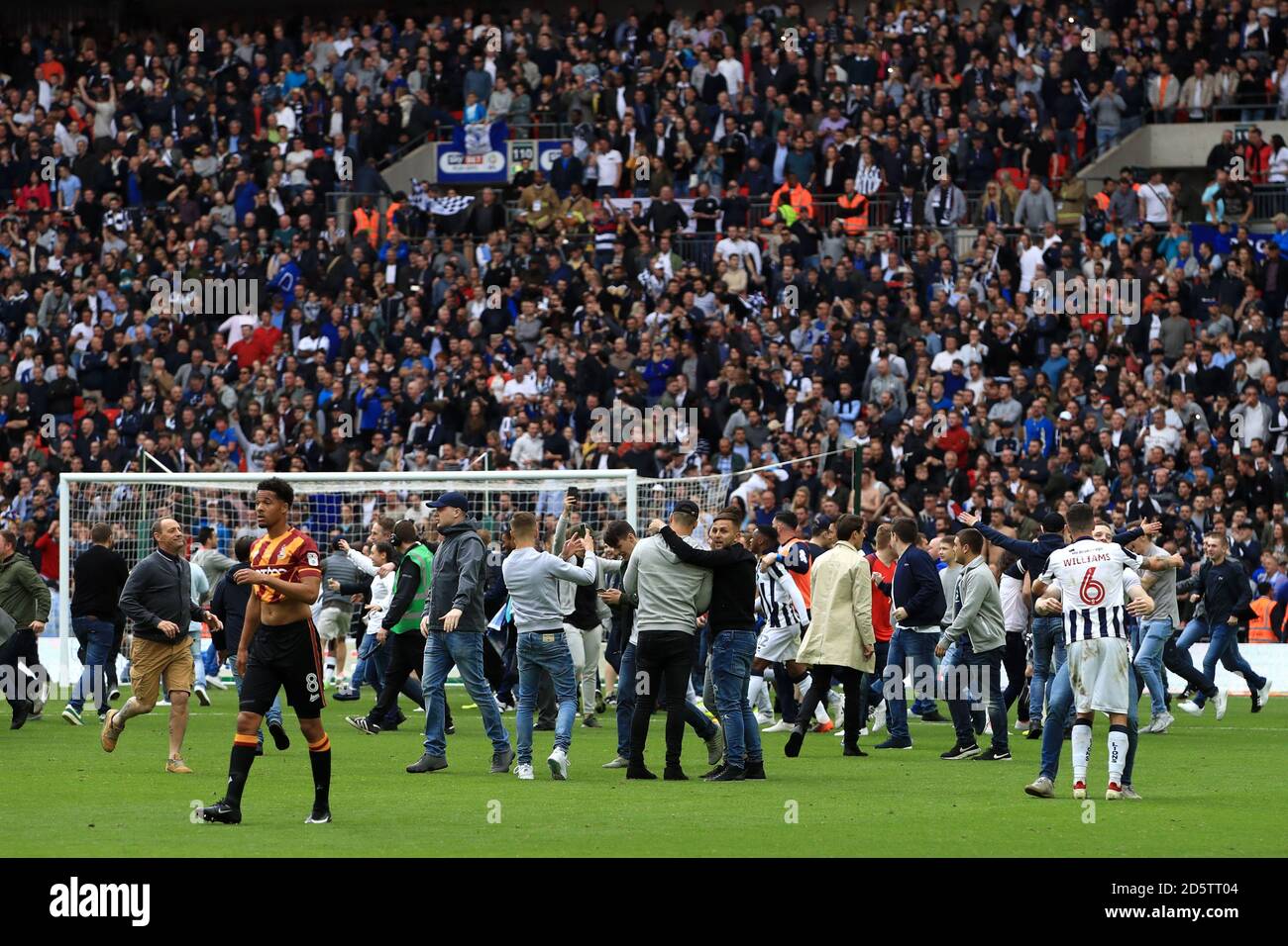 Millwall supporters invade the pitch in celebration after the final ...