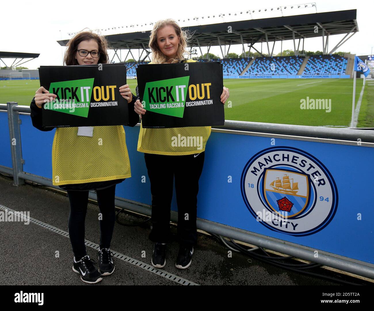 Young fans pose with kick it out posters prior to the FA WSL game ...
