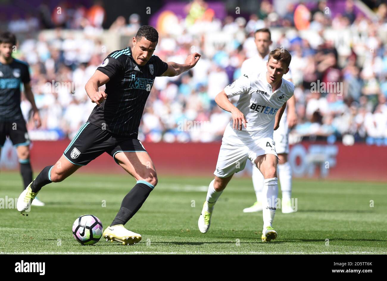 Swansea City's Tom Carroll (right) and West Bromwich Albion's Jake ...