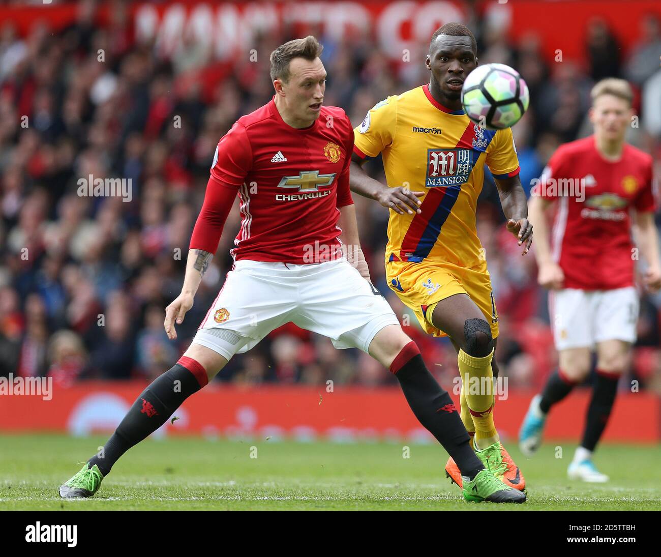 Manchester United's Phil Jones (left) and Crystal Palace's Christan ...