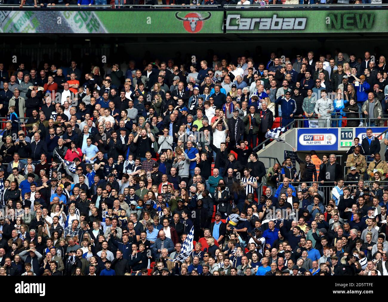 Millwall fans celebrate in the stands Stock Photo - Alamy