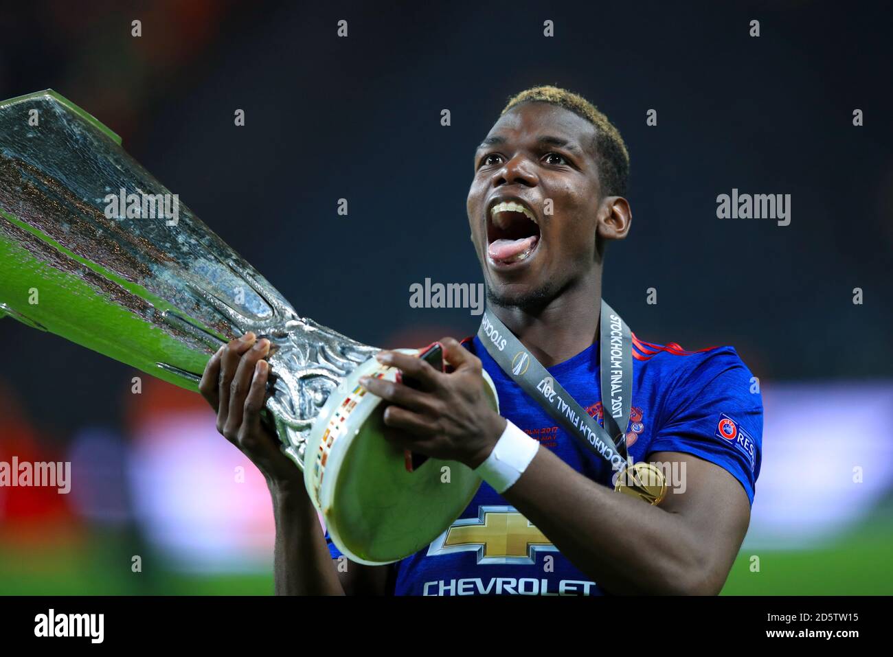 Manchester United's Paul Pogba celebrates with the trophy after winning ...