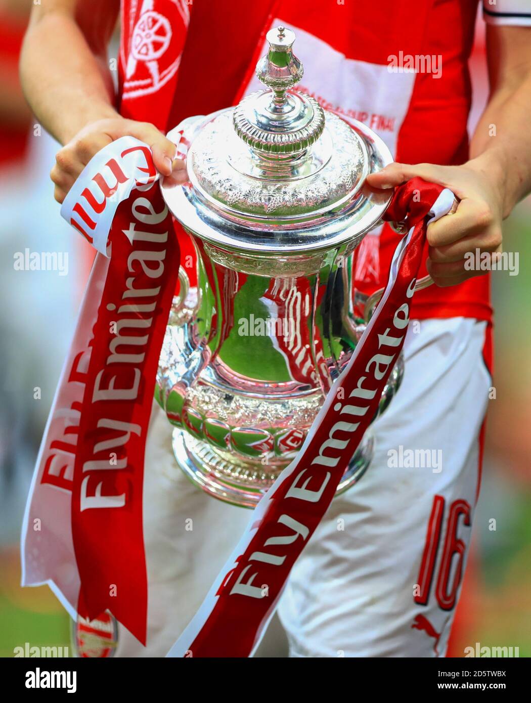 Arsenal's Rob Holding holds the FA Cup trophy after his side win Stock ...