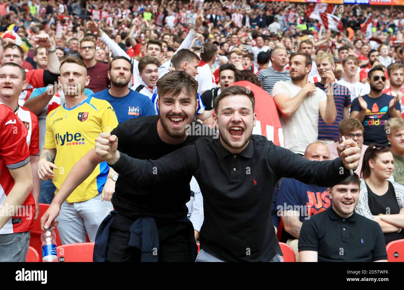 Fans in the stands pose for a picture Stock Photo - Alamy