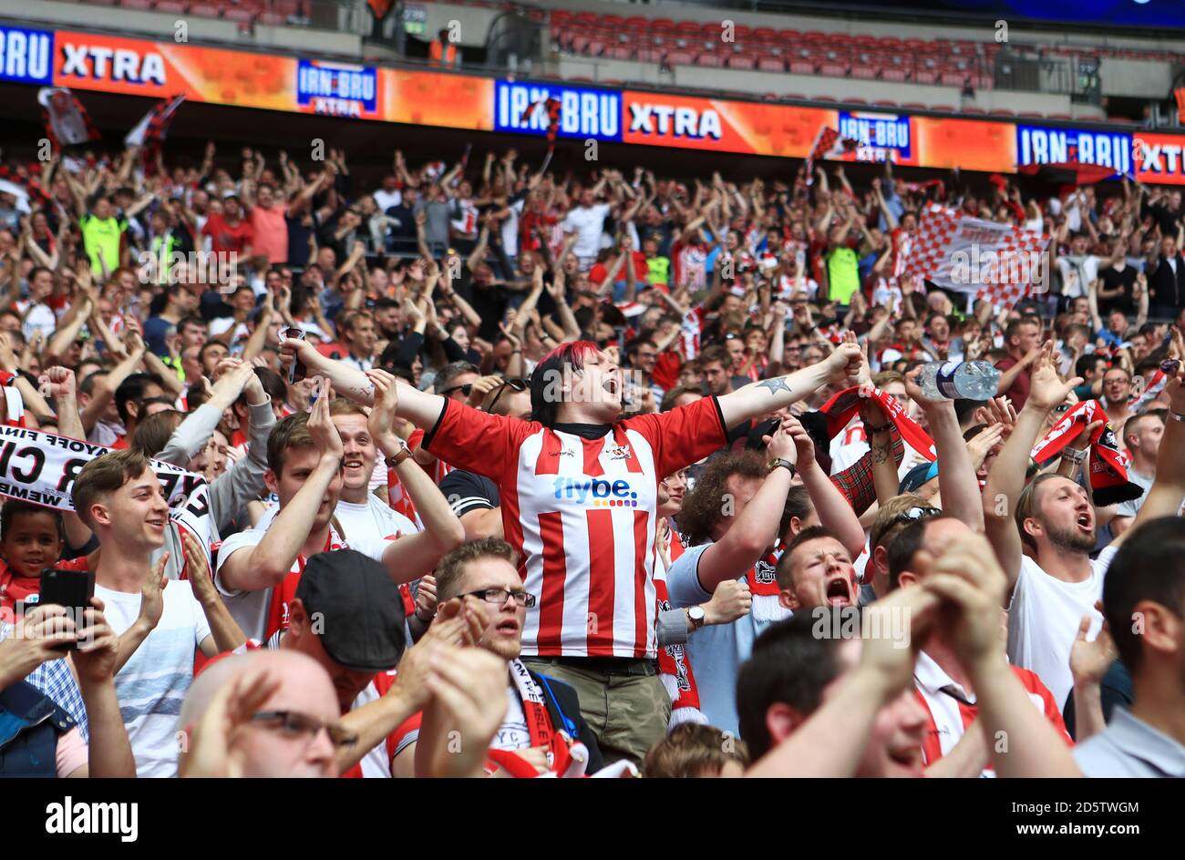 Exeter City fans show their support in the stands Stock Photo - Alamy