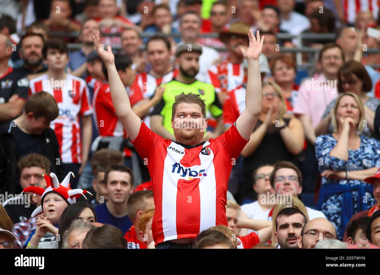 Exeter City fans in the stands Stock Photo - Alamy