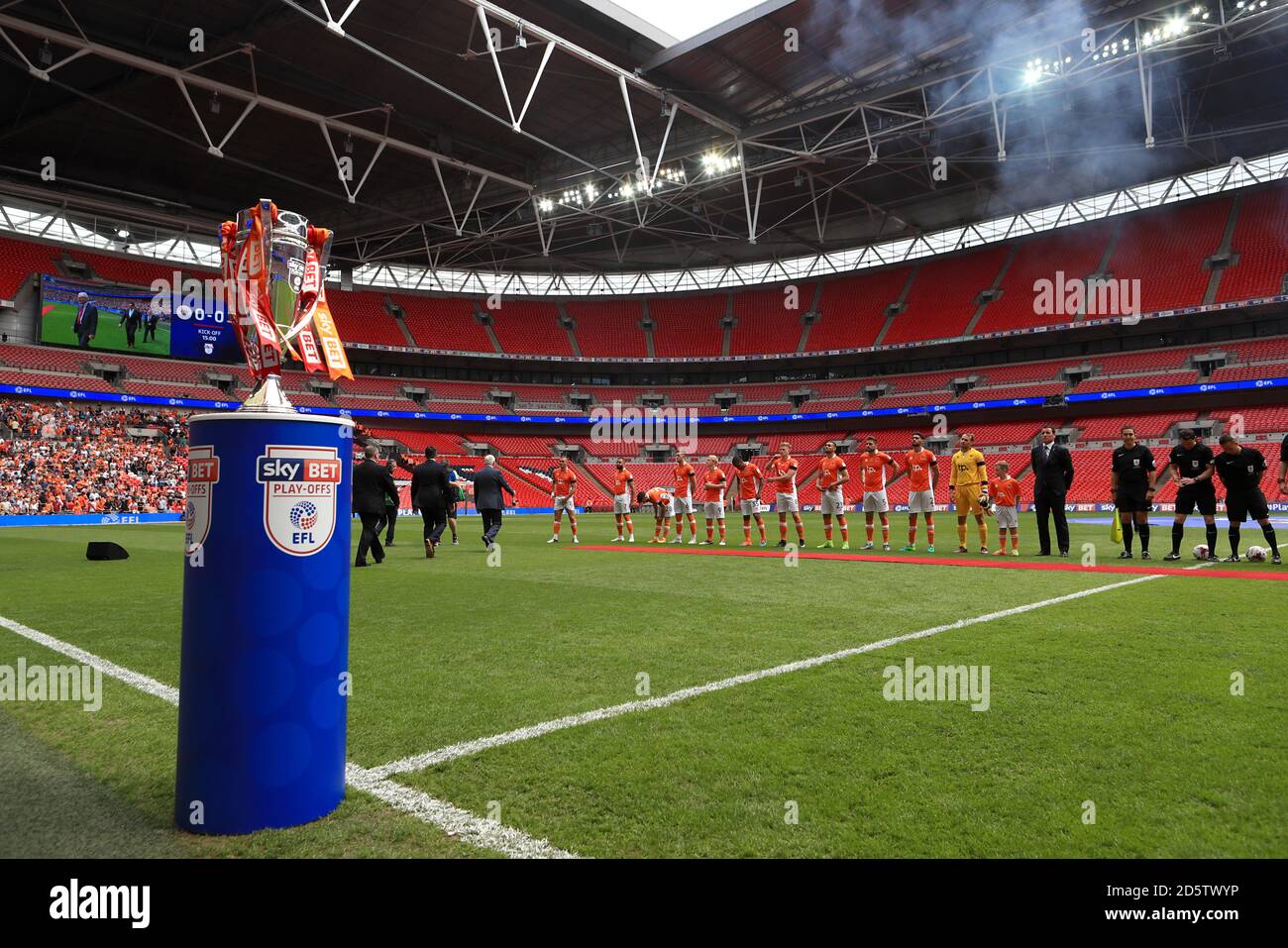 Blackpool team line up behind the Sky Bet League Two play off trophy ...