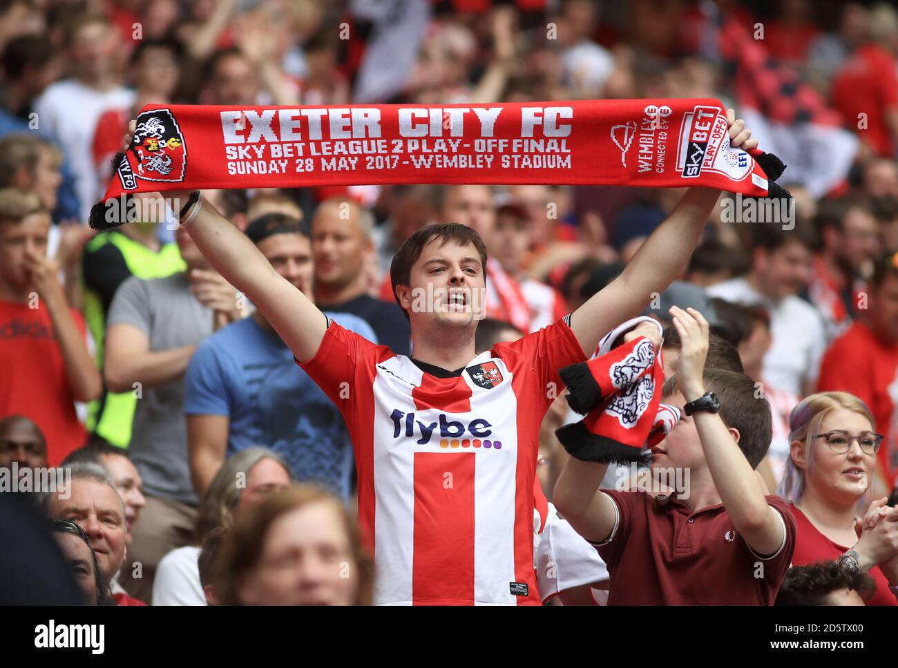 Exeter City fans in the stands Stock Photo - Alamy