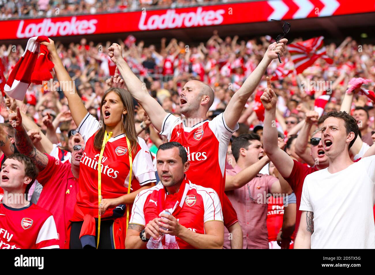 Arsenal fans in the stands Stock Photo - Alamy