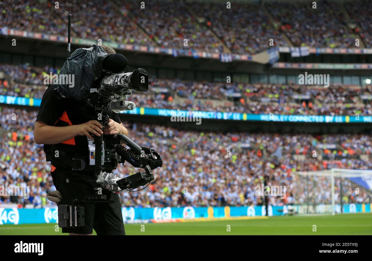 A television cameraman pitchside Stock Photo - Alamy