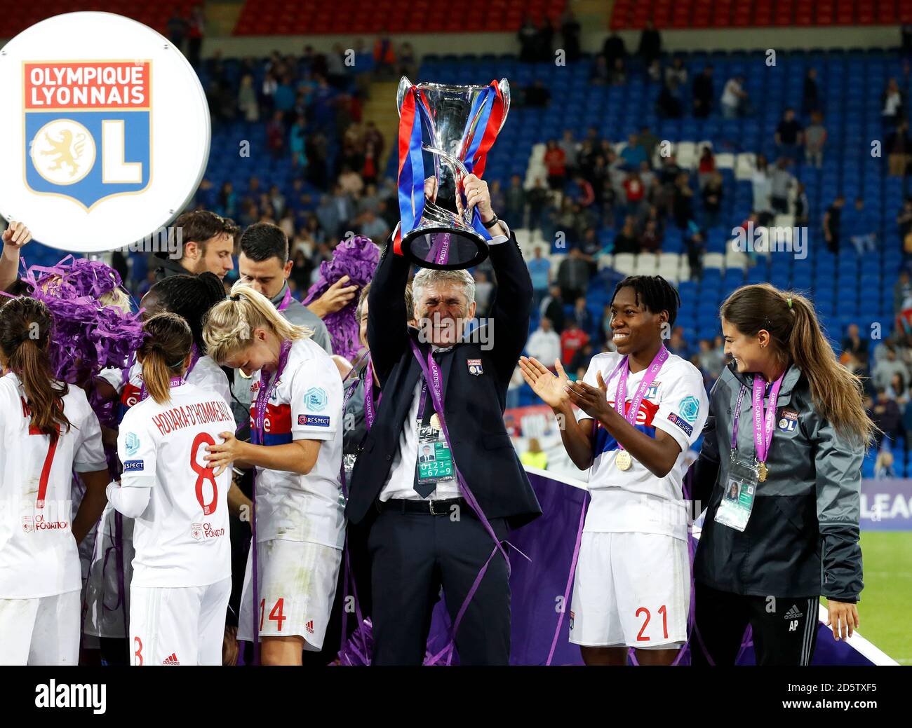 Lyon manager Jean-Michel Aulas lifts the trophy following the UEFA ...