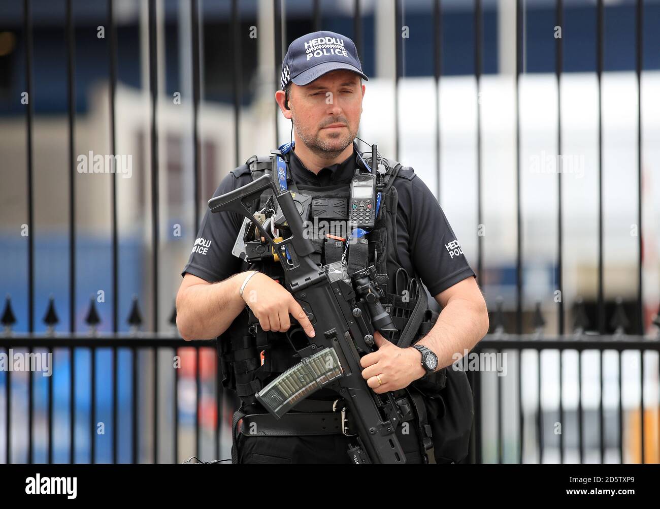 Armed police on patrol outside the stadium prior to the match Stock ...