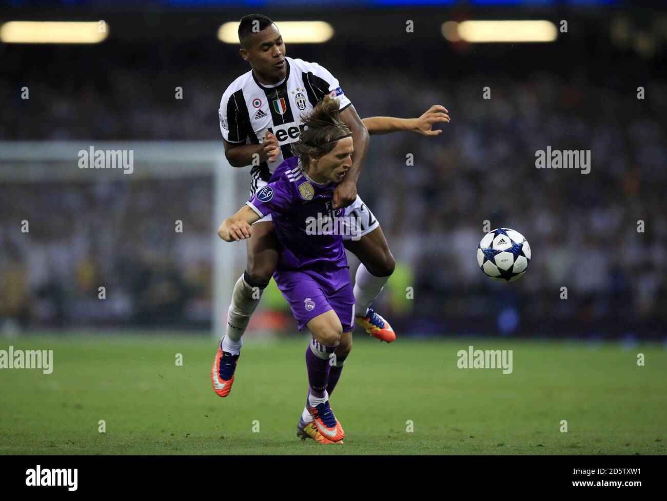 Juventus' Alex Sandro (left) and Real Madrid's Luka Modric battle for ...