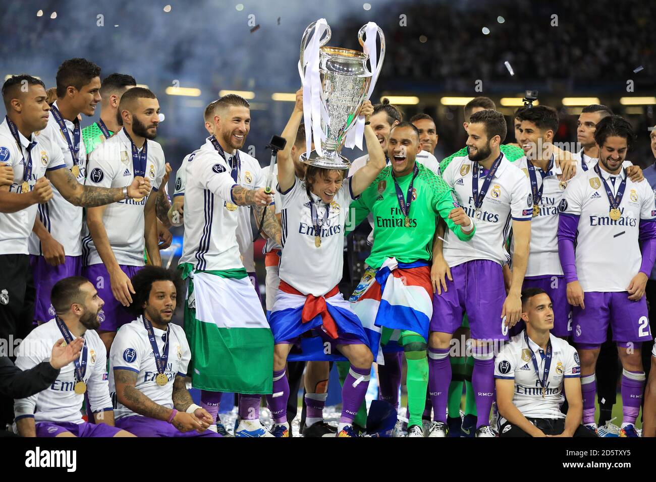 Real Madrid's Luka Modric (centre) celebrates with his team-mates and ...