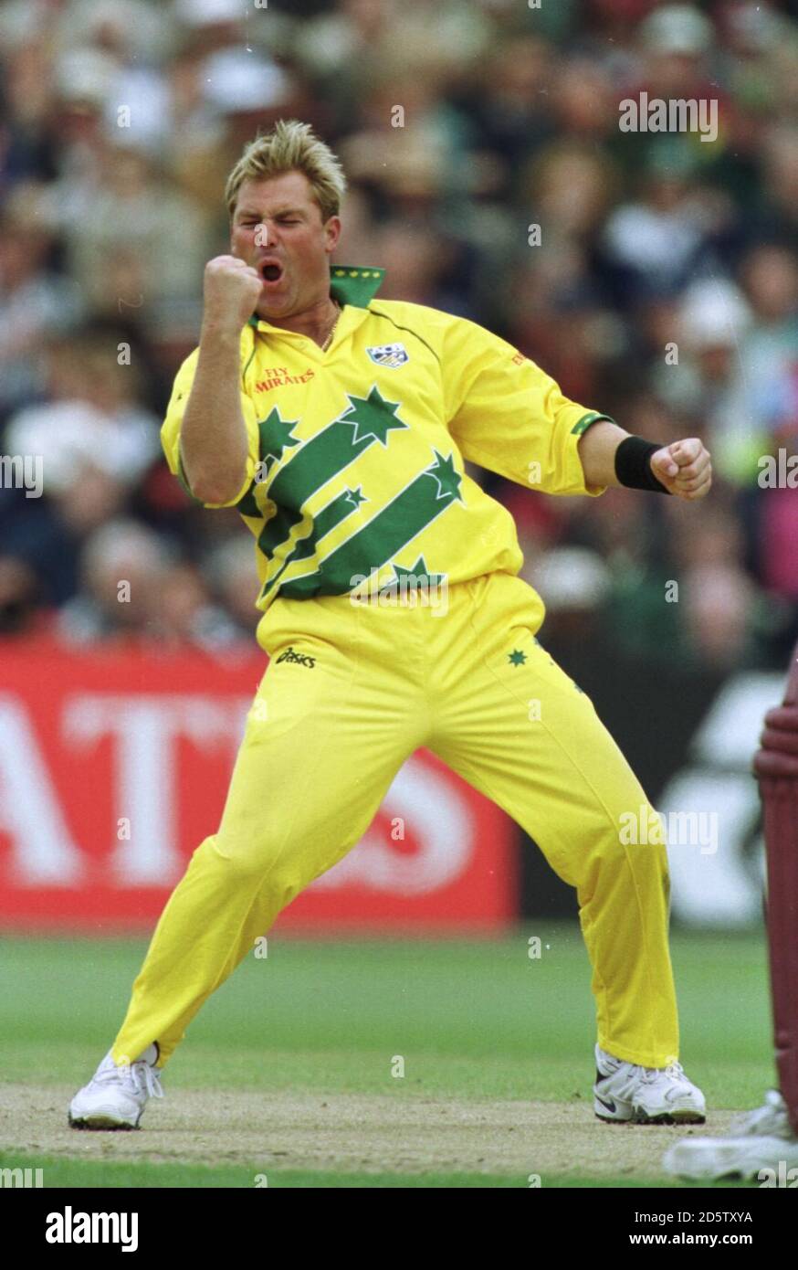 Australia's Shane Warne celebrates taking the wicket of Curtley Ambrose ...