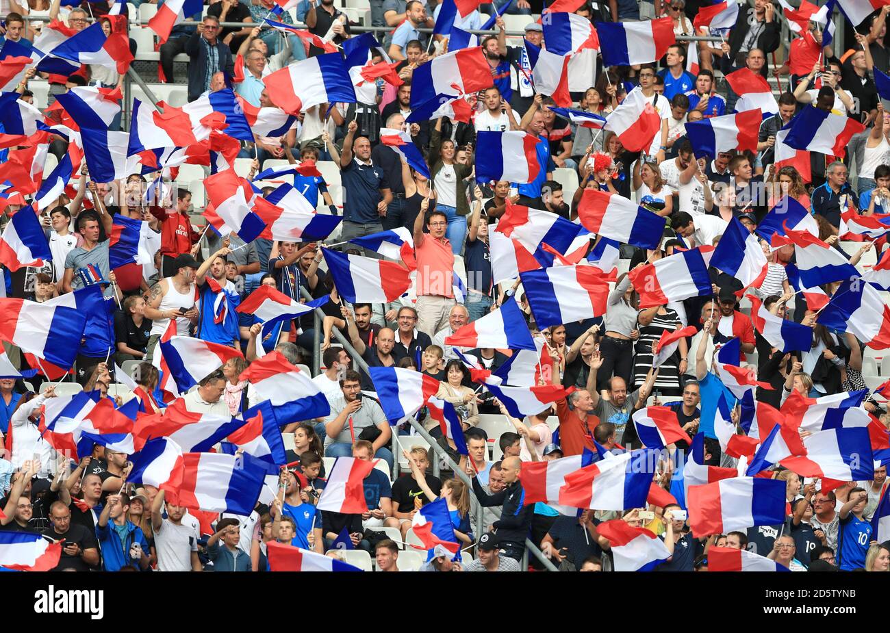 France fans wave flags in the stands before kick-off Stock Photo - Alamy
