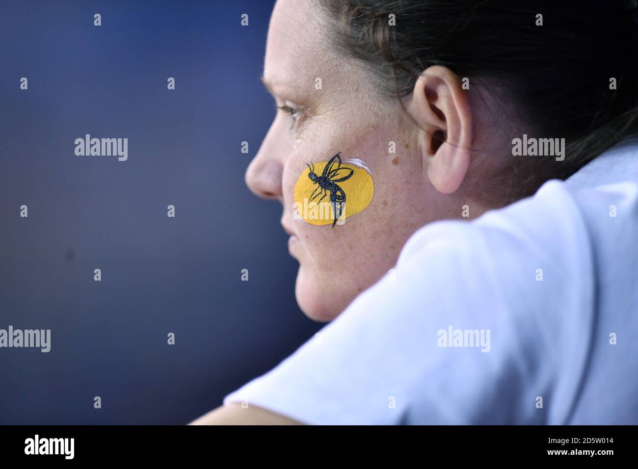 A member of the crowd shows her support with a Wasps Netball temporary ...