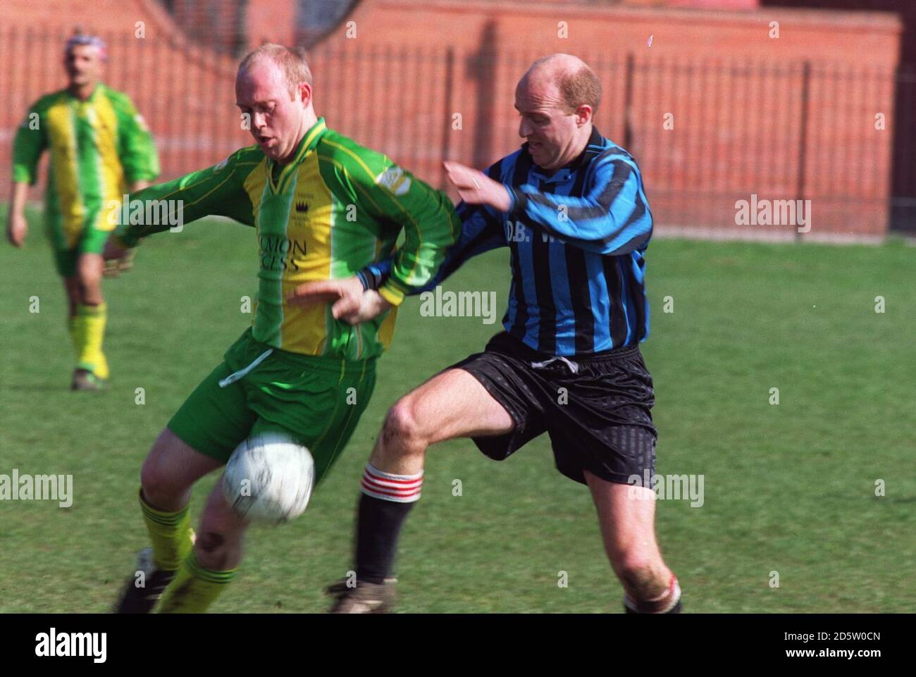 Two bald soccer players battle for the ball Stock Photo - Alamy