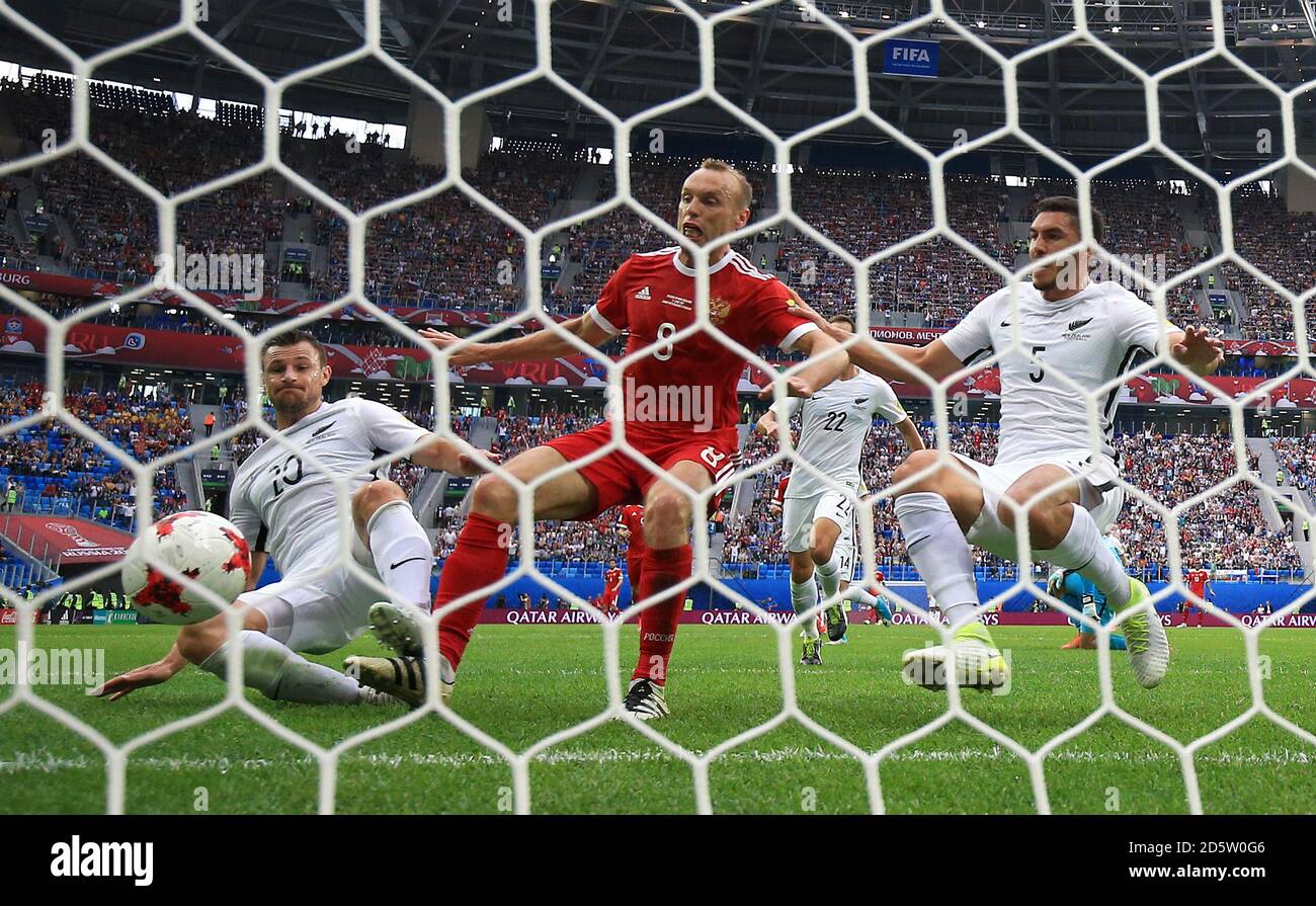 New Zealand's Michael Boxall (right) scores an own goal, giving Russia ...
