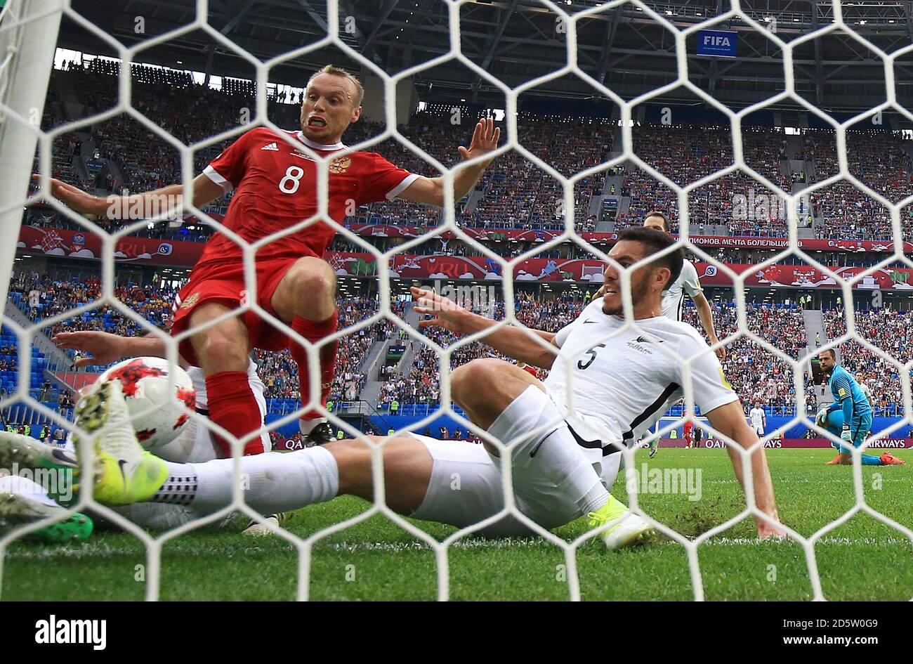 New Zealand's Michael Boxall (right) scores an own goal, giving Russia ...