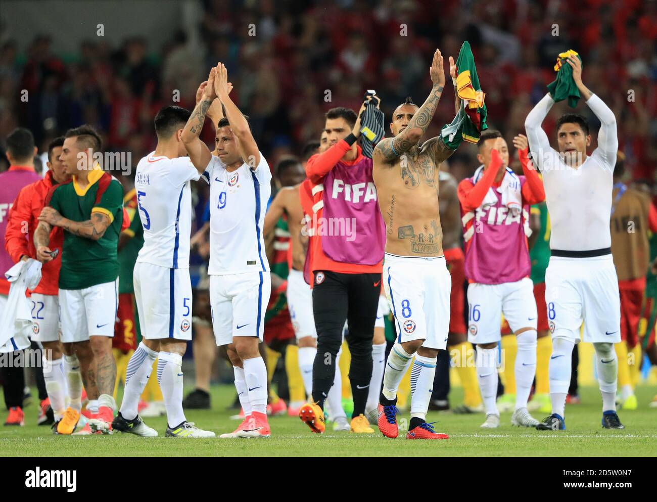 Chile's Angelo Sagal (9) and Arturo Vidal (8) celebrate victory after ...