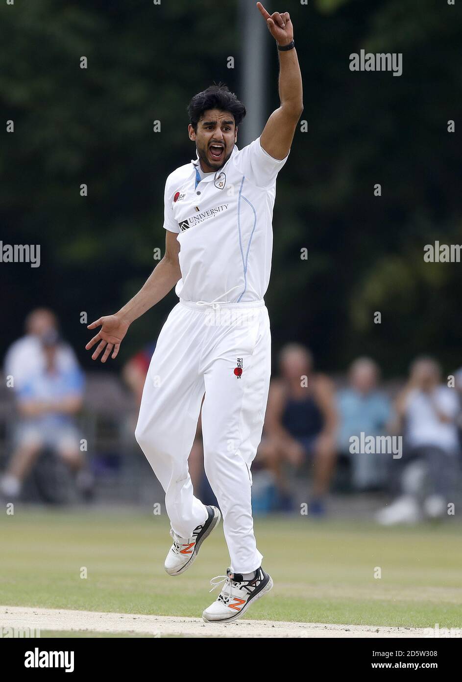 Derbyshire's Gurjit Sandhu celebrates taking the wicket of Durham's ...
