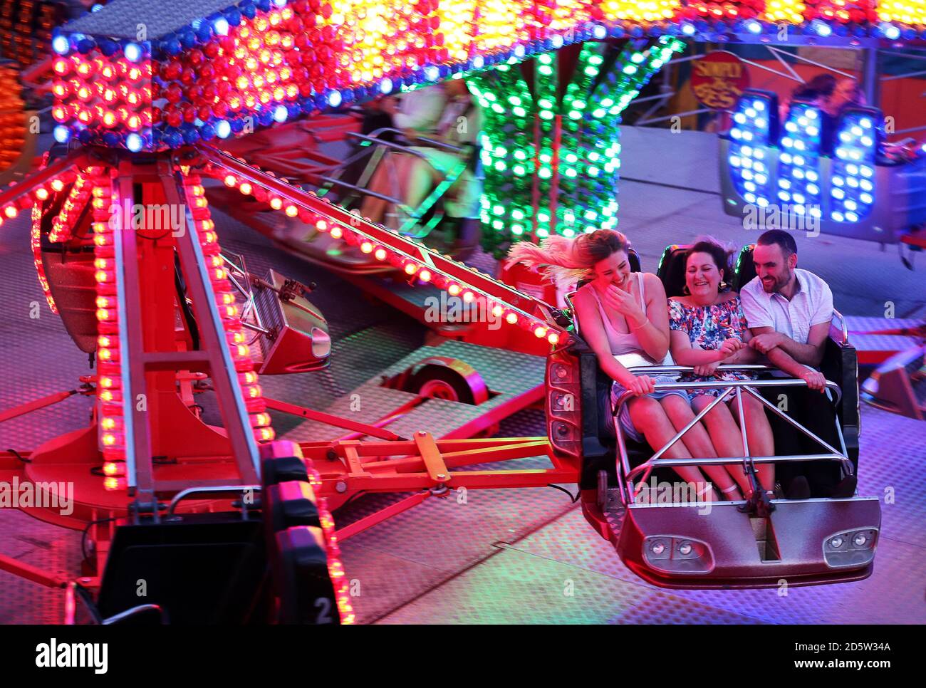 Guests enjoy the attractions at the MW Solicitors Summer Party held at ...