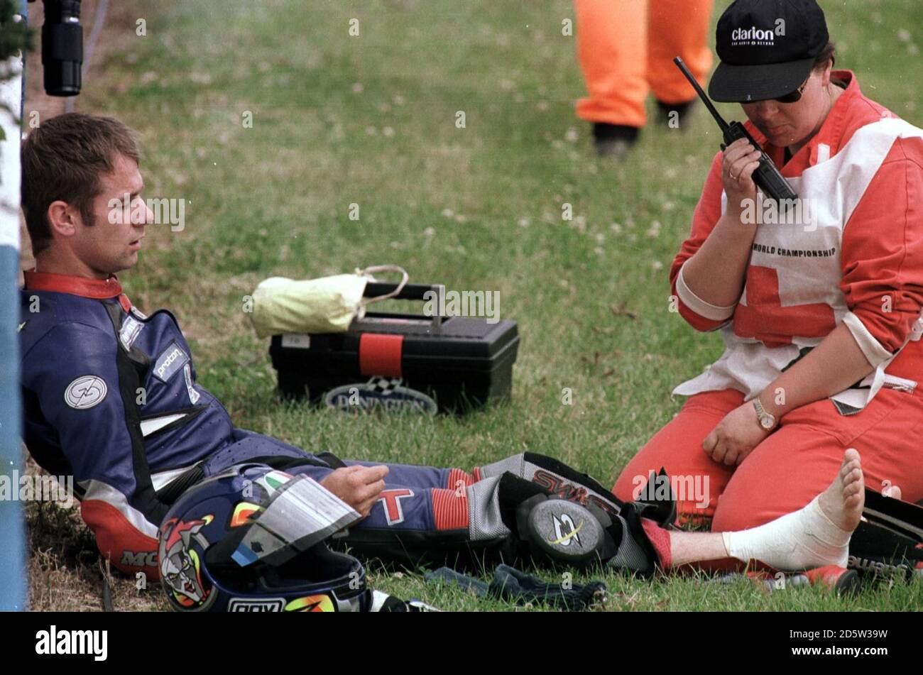 Britain's Jamie Whitham is treated at the trackside after crashing out ...