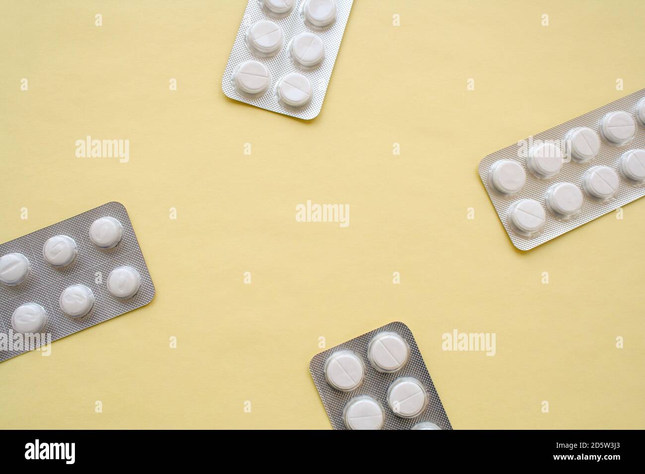 white round tablets, four packs of tablets, located on one package on ...