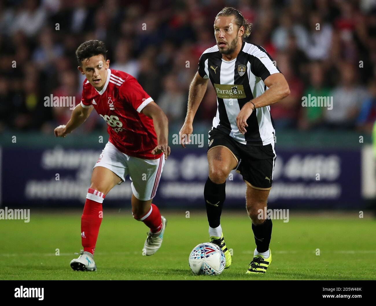 Notts County's Alan Smith holds off challenge from Nottingham Forest's ...