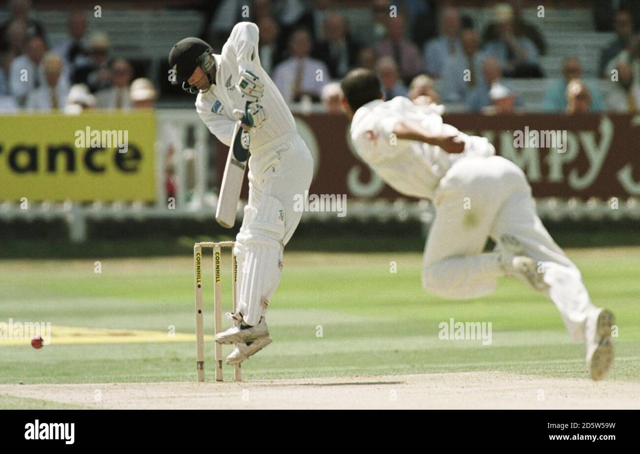 England's Nathan Astle gets airborne off a New Zealand delivery from ...
