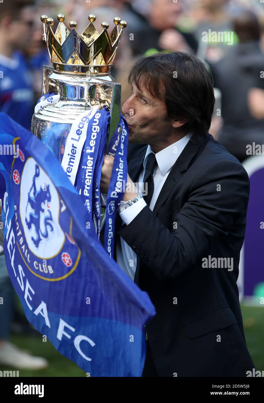 Chelsea manager Antonio Conte celebrates with the Premier League trophy ...